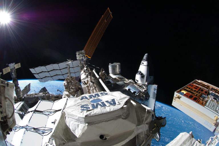 Alpha-Magnetic Spectrometer: Decoding the Dark Matter Puzzle From Space
