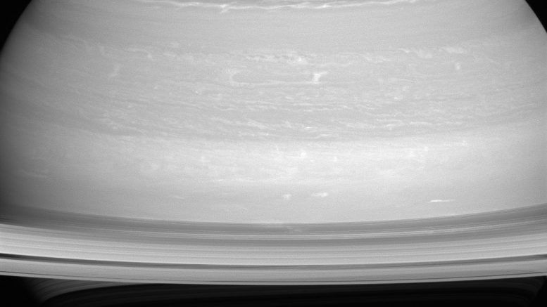 New Cassini Image Shows a Tiny Mimas, Huge Saturn Rings