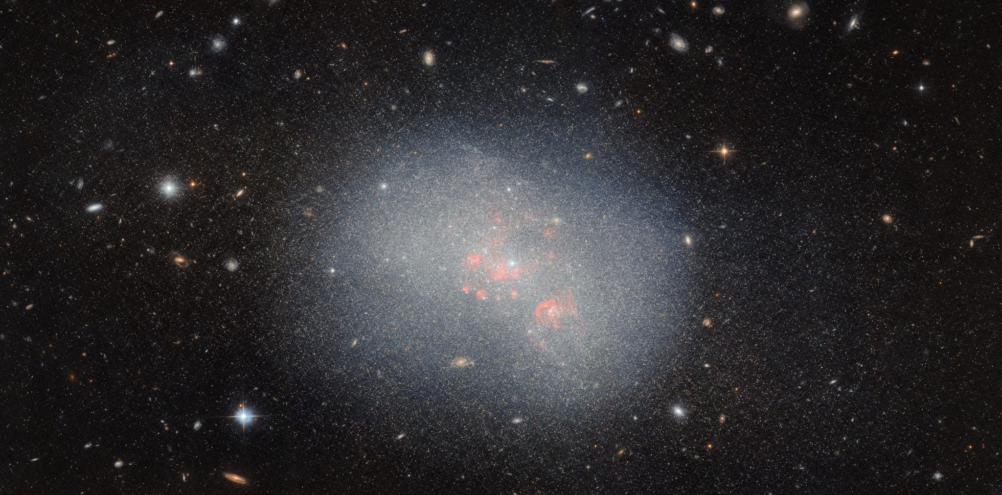 Assembling the Cosmos: Hubble Reveals How Dwarf Galaxies Shape the ...