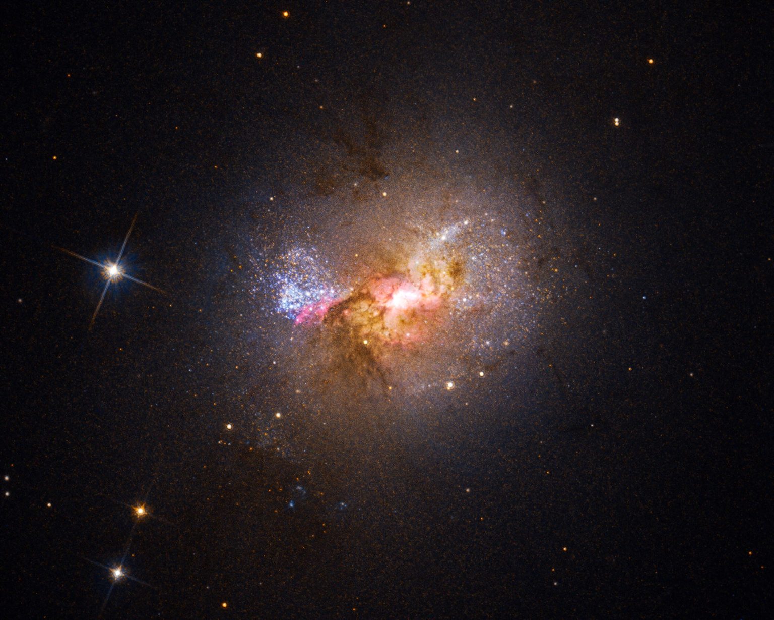 Hubble Spots a Black Hole Igniting a Firestorm of Star Formation in a ...