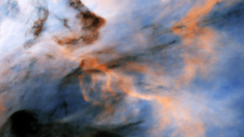 Dark, Dusty Heart: Hubble Captures Swirls of Dust in the Flame Nebula