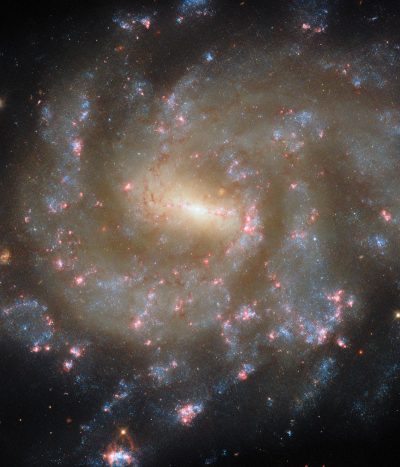 Hubble Captures a Stunning Spiral Galaxy Bursting With Newborn Stars