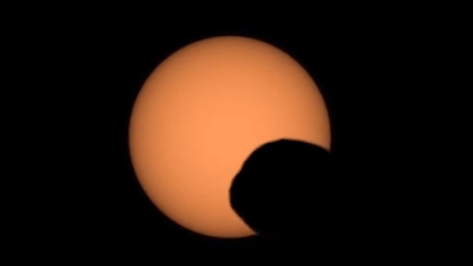 Eerie Eclipse on the Red Planet: NASA’s Perseverance Spots “Googly Eye ...