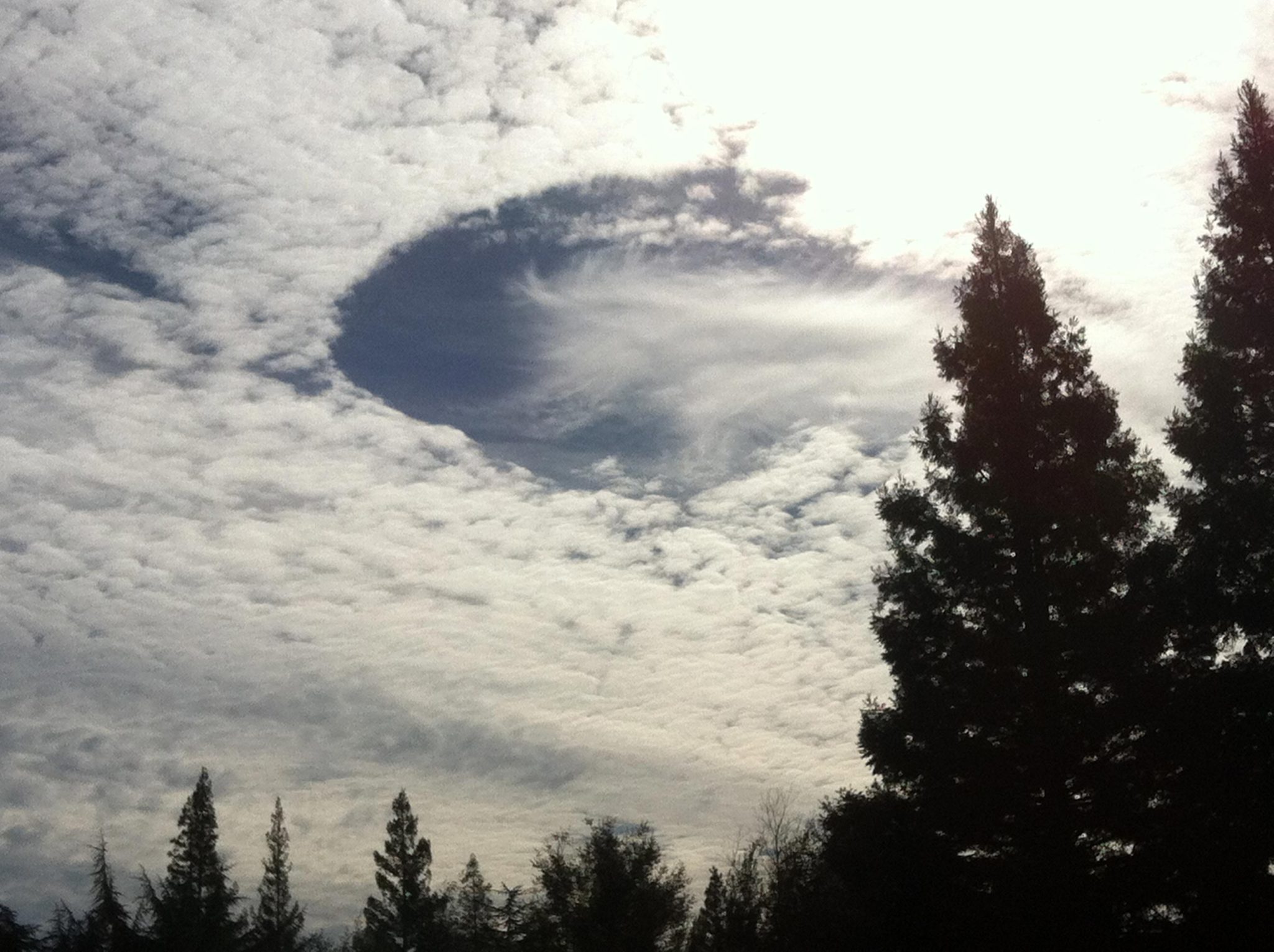 How Airplanes Create Stunning Holes in the Sky