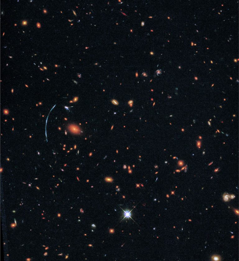 Hubble Telescope Spots Clumps of New Stars in Distant Galaxy