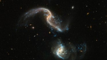 Seyfert’s Symphony: Hubble Showcases a Breathtaking Galactic Collision