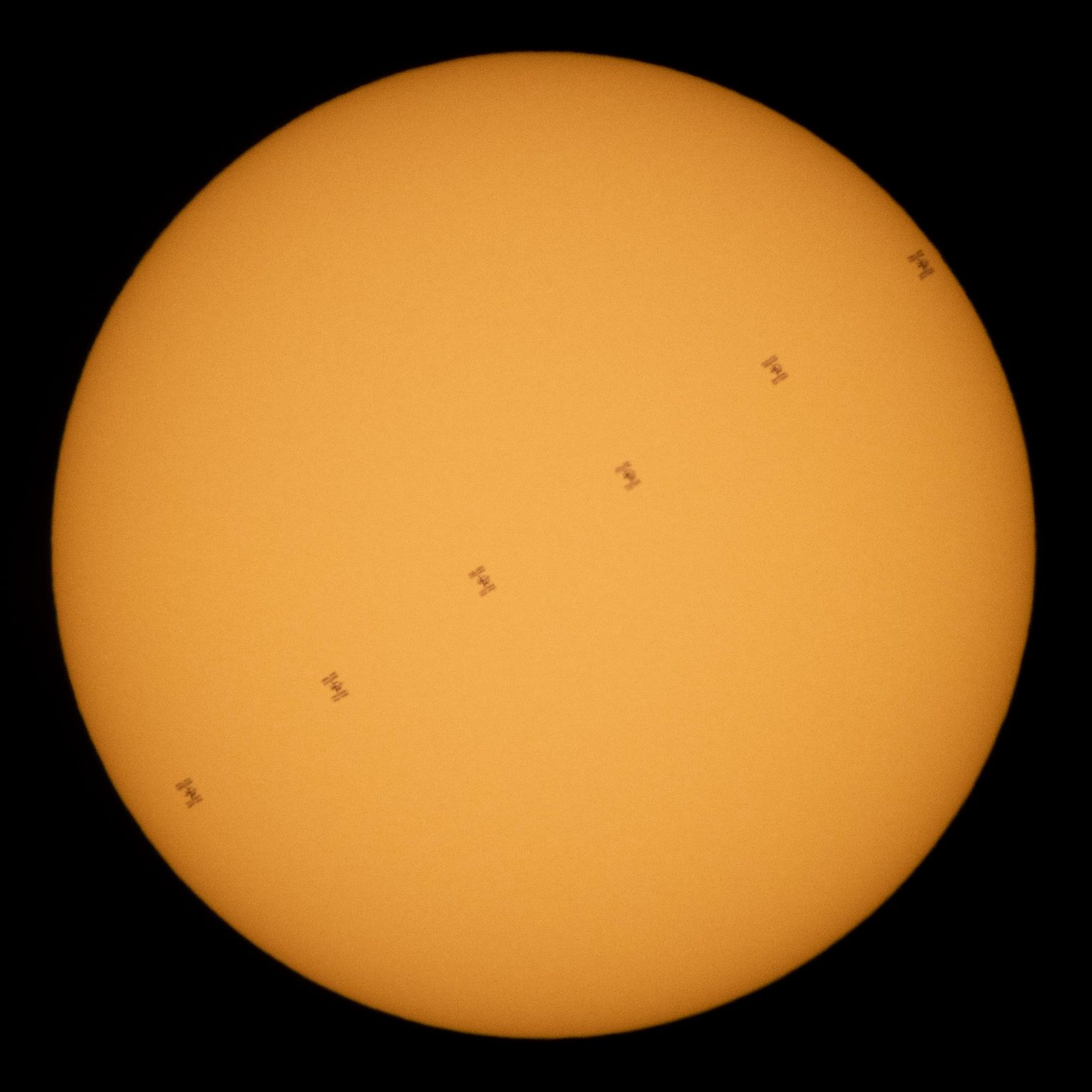 Spectacular New Images Capture the Space Station Cruise Across the Sun