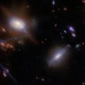 Webb Captures “Impossible” Glow From Galaxy at the Edge of Time