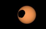 Eerie Eclipse on the Red Planet: NASA’s Perseverance Spots “Googly Eye ...