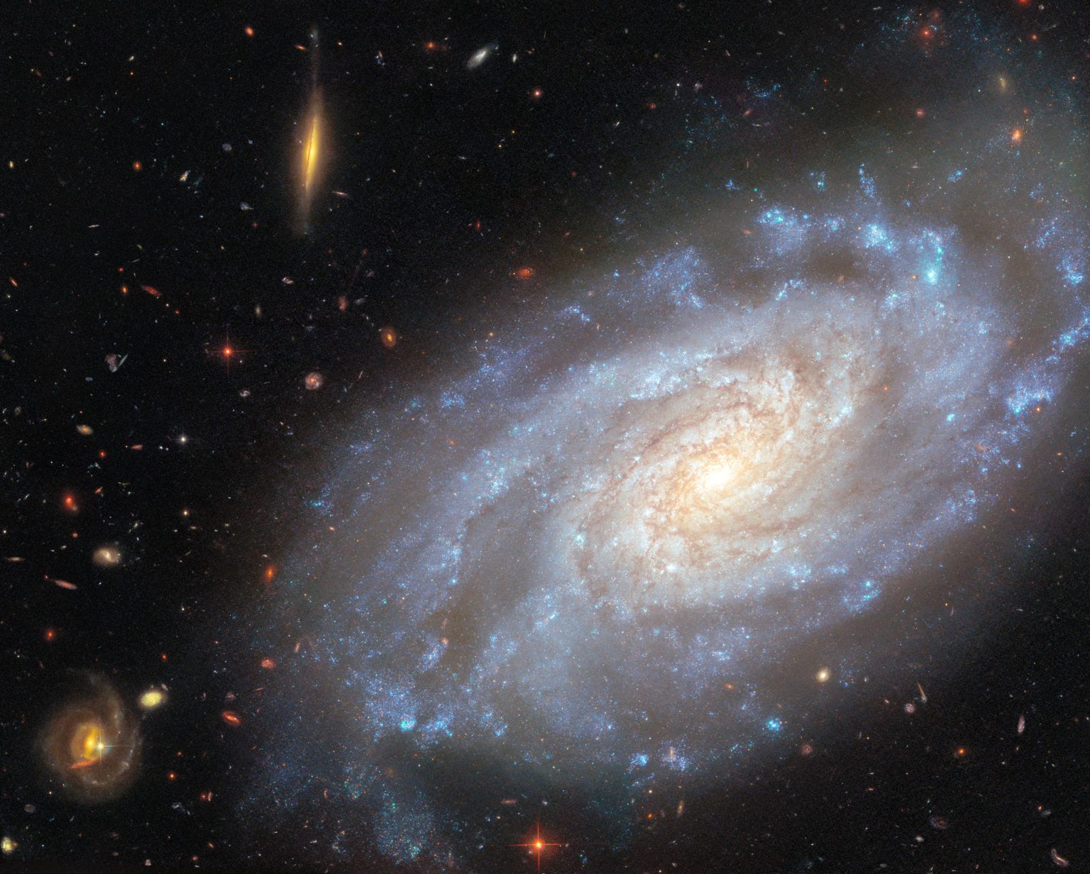 Hubble Zooms In on a Galaxy That Maps the Universe’s Expansion
