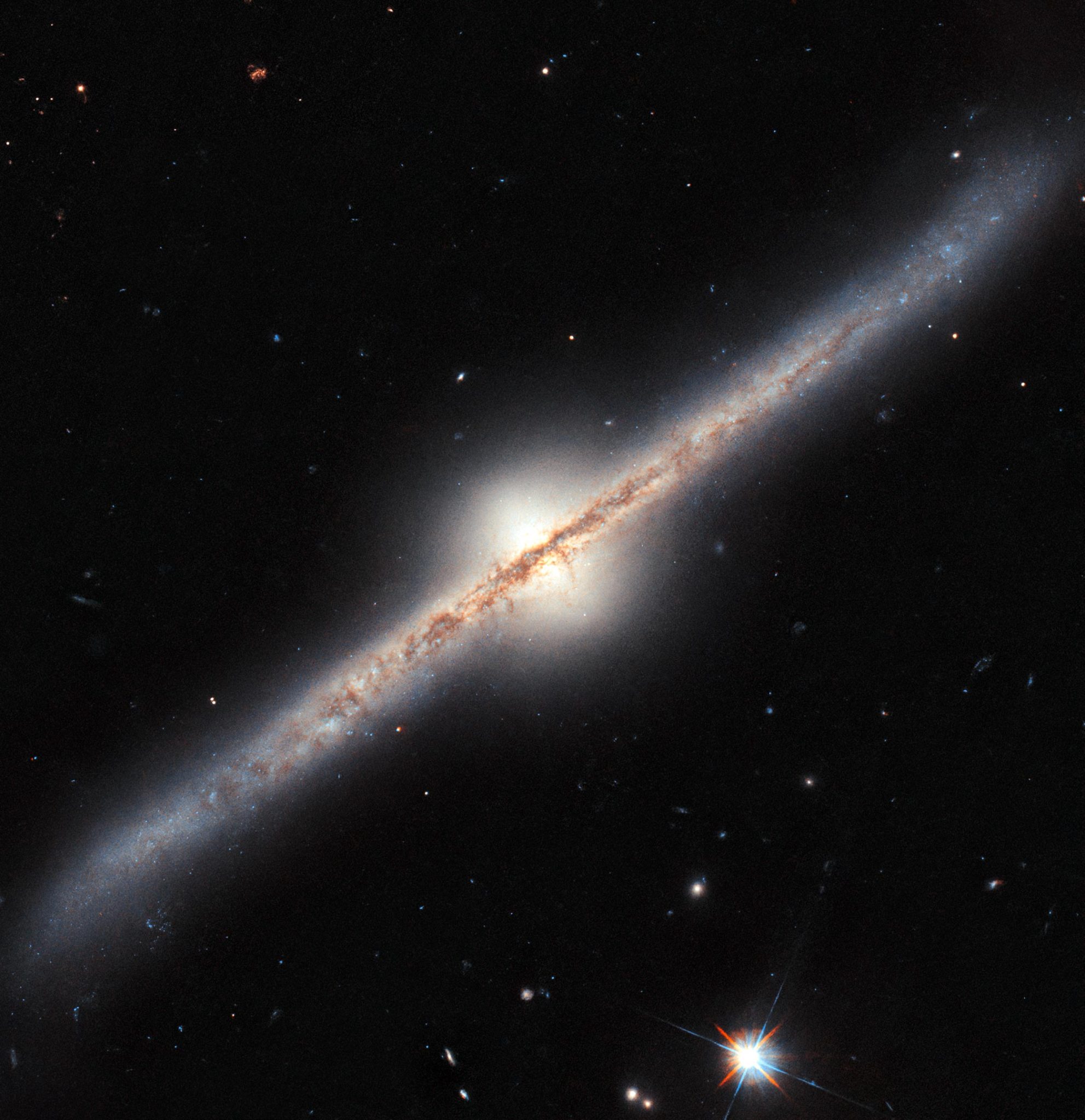 Hubble’s 23-Year Look at a Warped Spiral Galaxy Reveals Hidden Secrets