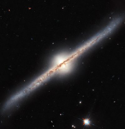 Hubble’s 23-Year Look at a Warped Spiral Galaxy Reveals Hidden Secrets