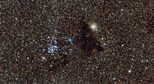 ESO Views Star Cluster NGC 6520 and its Dusty Neighbor Barnard 86
